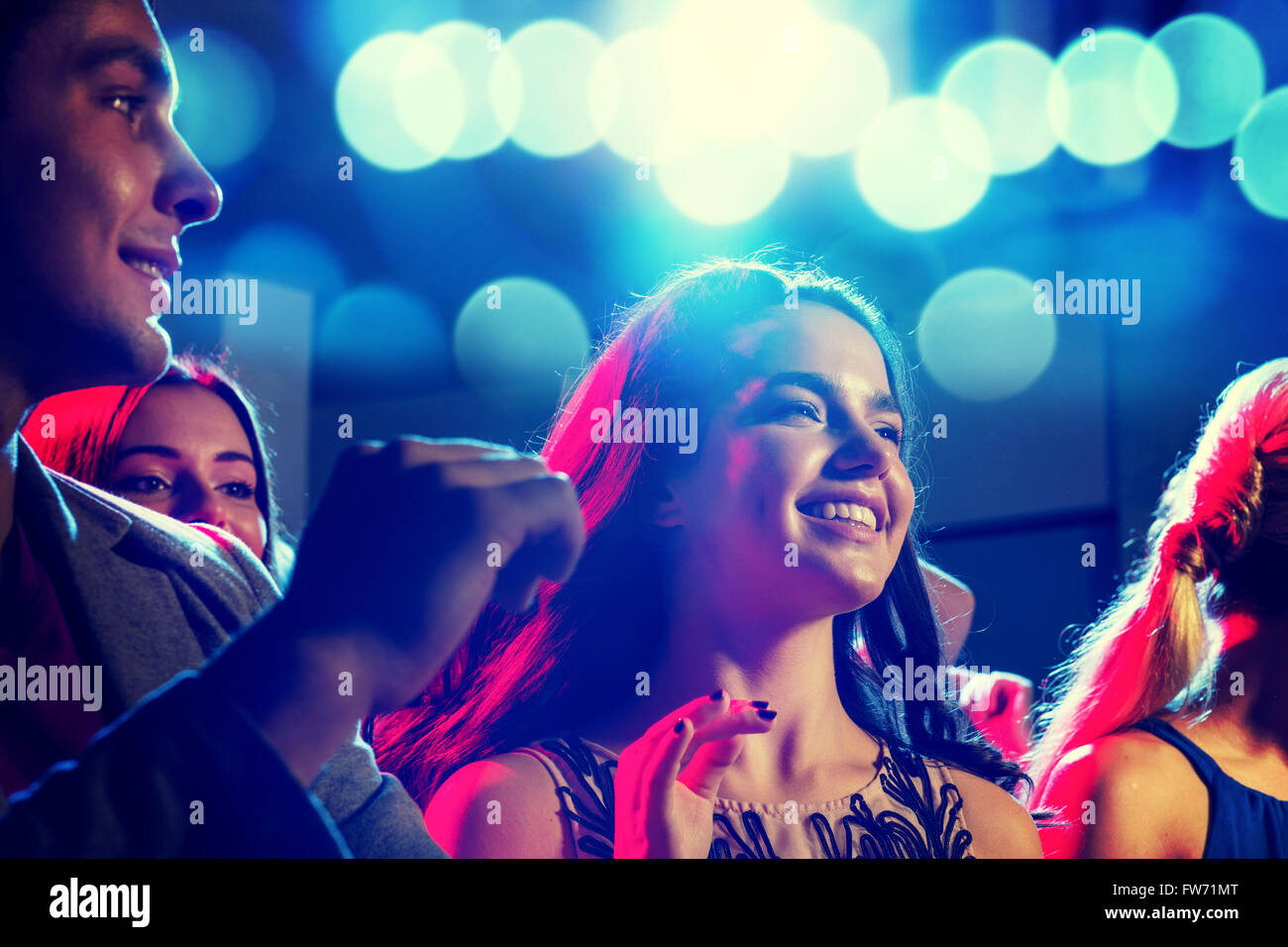smiling friends dancing in club Stock Photo - Alamy