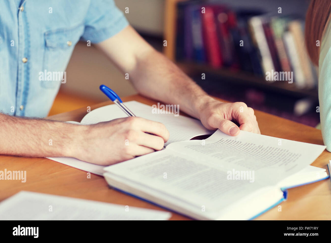 close up of student hands writing to notebook Stock Photo - Alamy