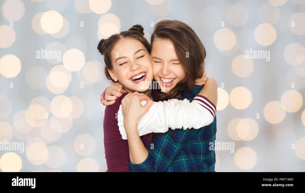 happy smiling pretty teenage girls hugging Stock Photo - Alamy