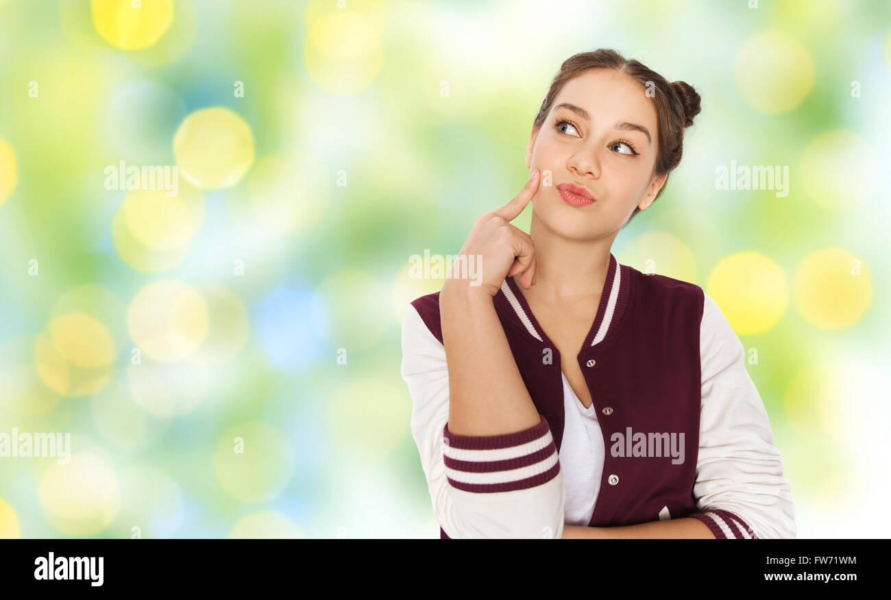 happy pretty teenage girl thinking Stock Photo - Alamy