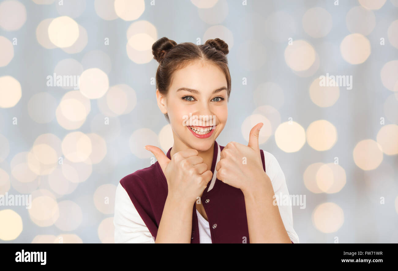 happy smiling teenage girl showing thumbs up Stock Photo - Alamy