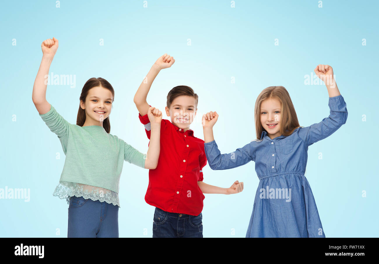 happy boy and girls celebrating victory Stock Photo - Alamy