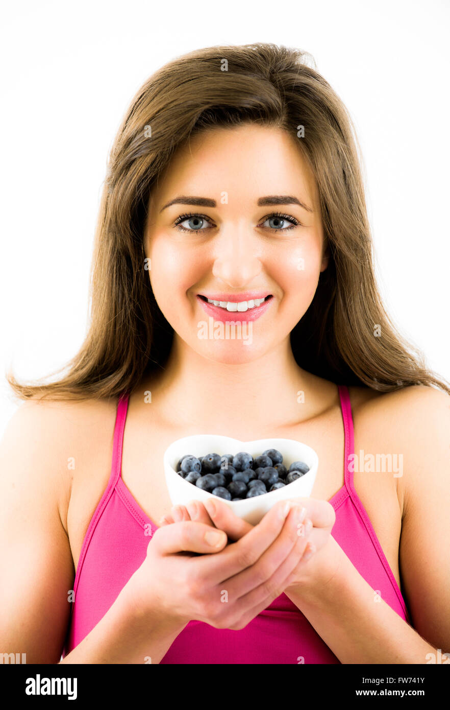 Female eating blueberries hi-res stock photography and images - Alamy