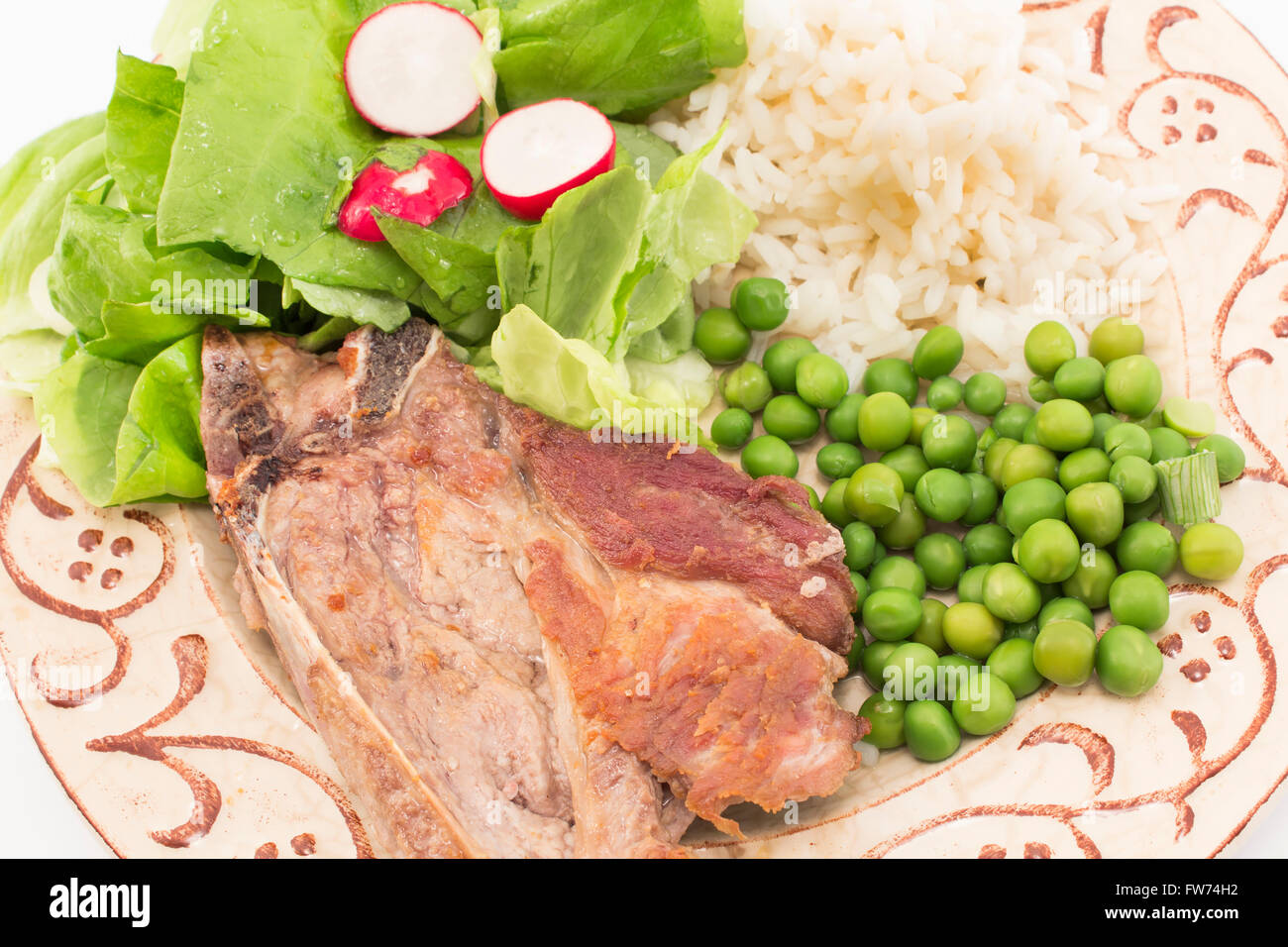 Pork neck with vegetables and rice Stock Photo - Alamy