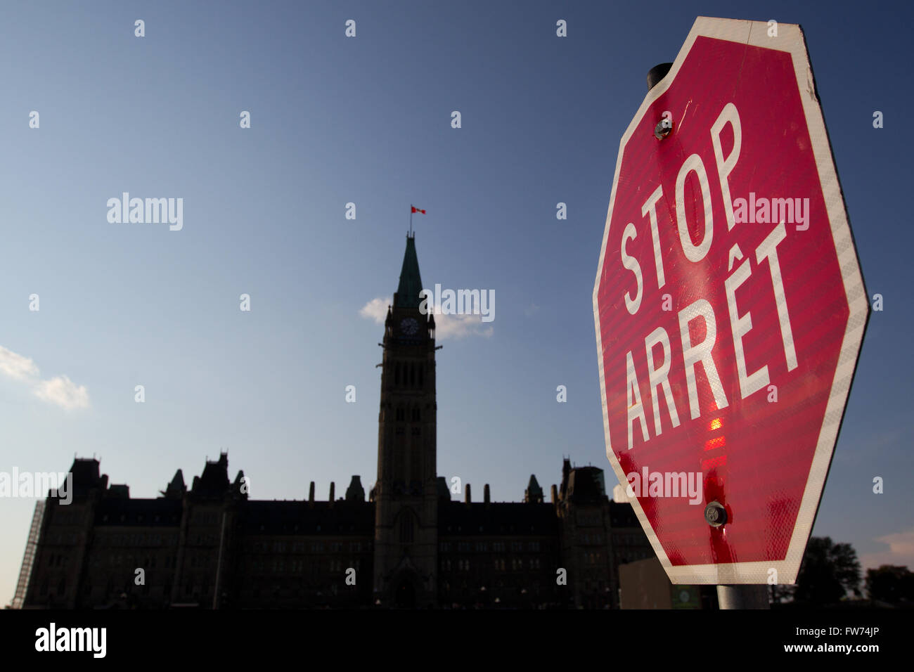 A stop sign sits in front of Centre block on Parliament Hill in Ottawa ...