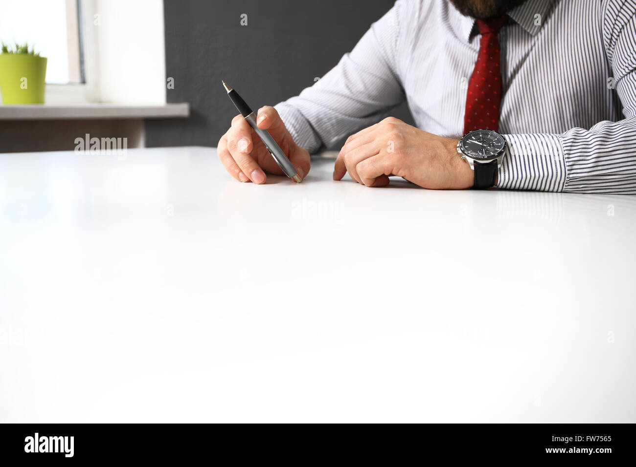 male hand pointing at business document during discussion at meeting ...