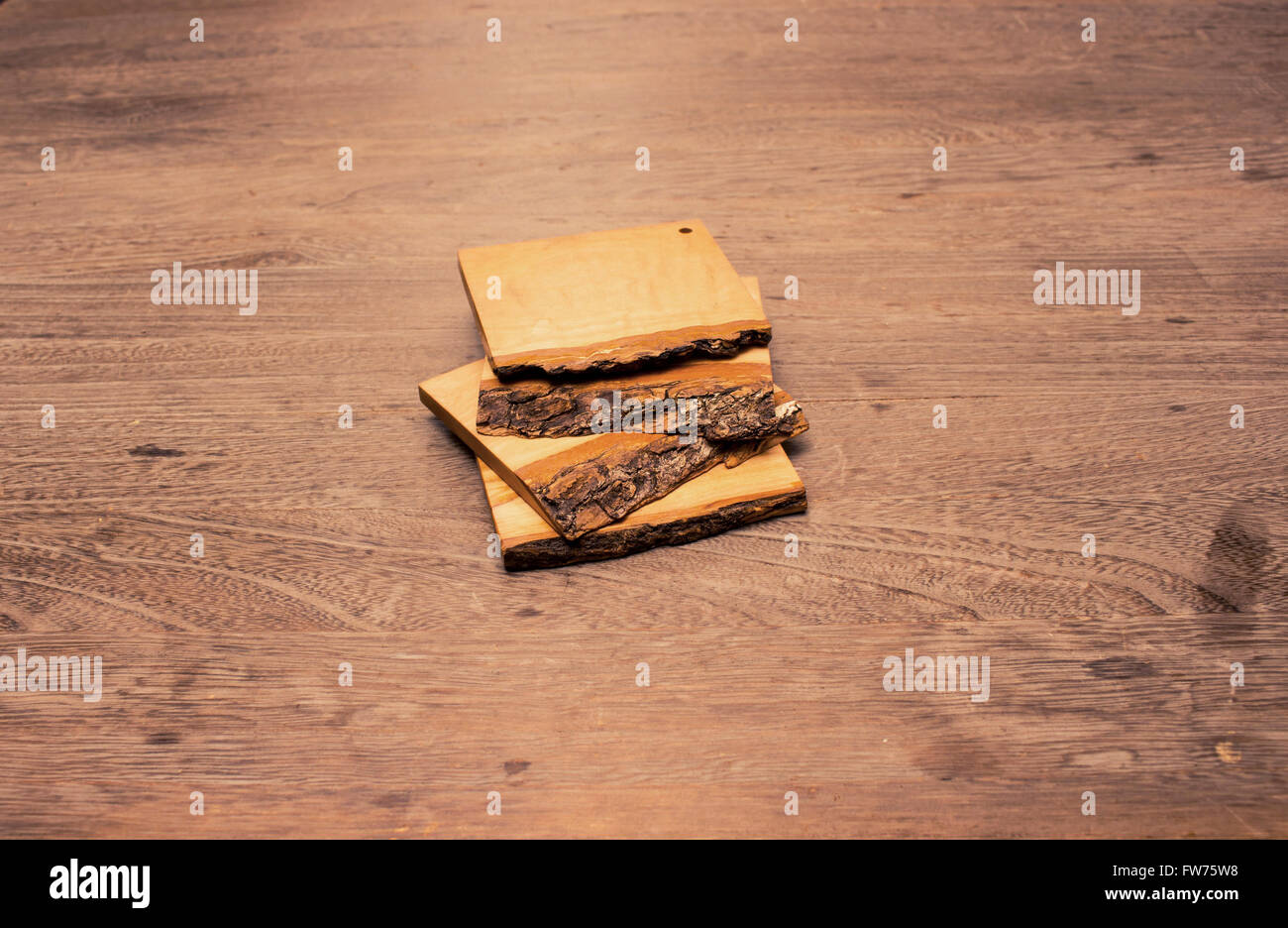 Wood coasters on wood table Stock Photo - Alamy