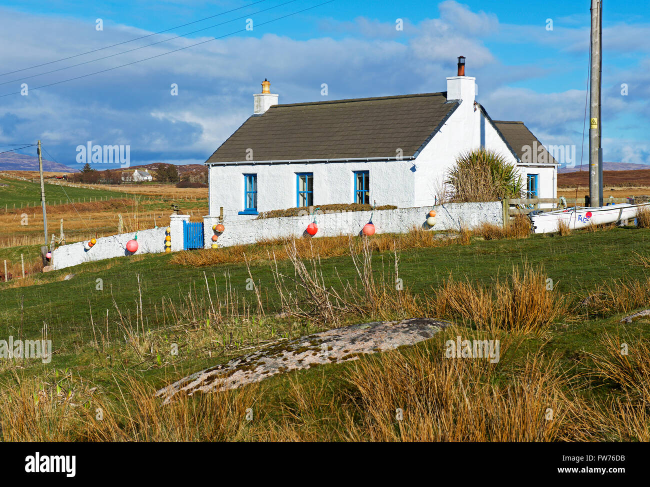 Cottage decporated with buoys, in the village of Fionnphort, Isle of ...