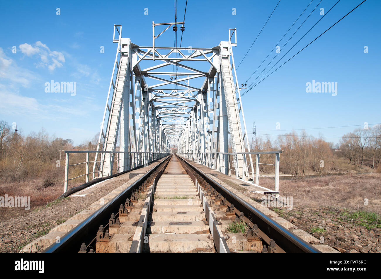 railroad bridge of steel, inside view passes over the river, around the ...