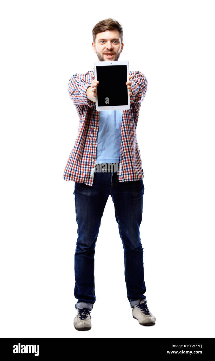 Smiling young man using tablet computer against white background Stock ...
