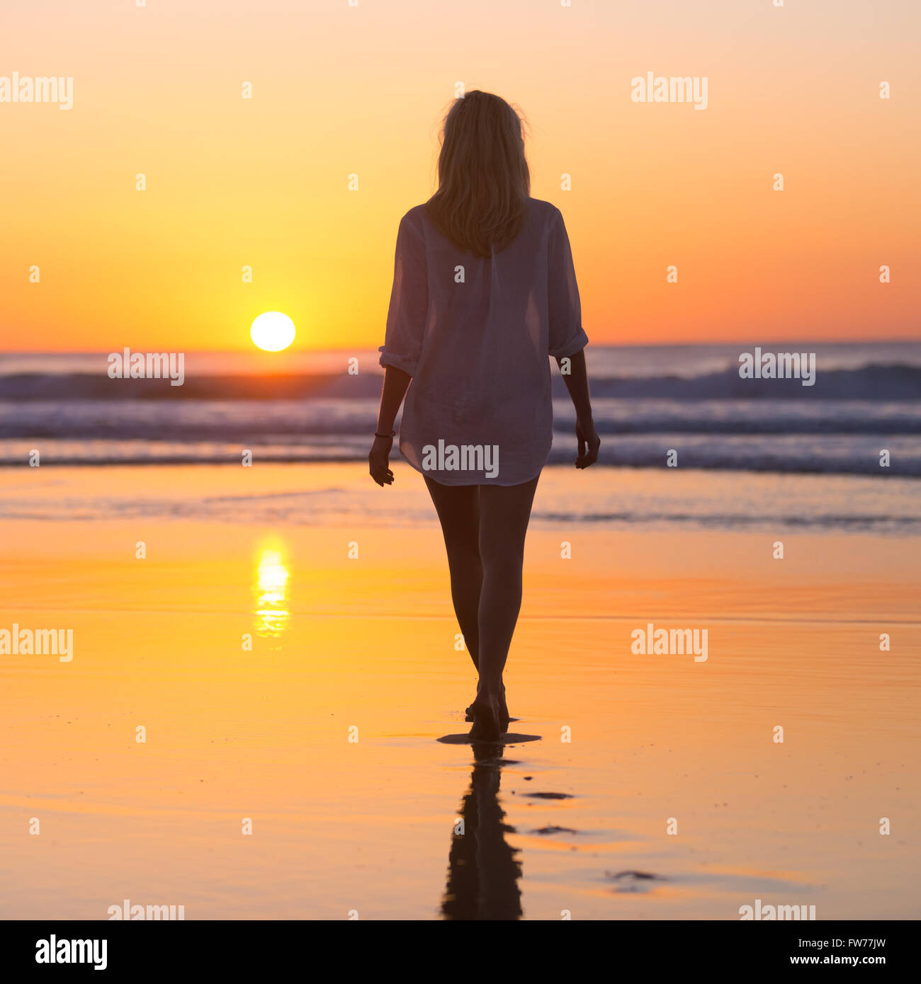 Beautiful woman walking on sandy hi-res stock photography and images ...