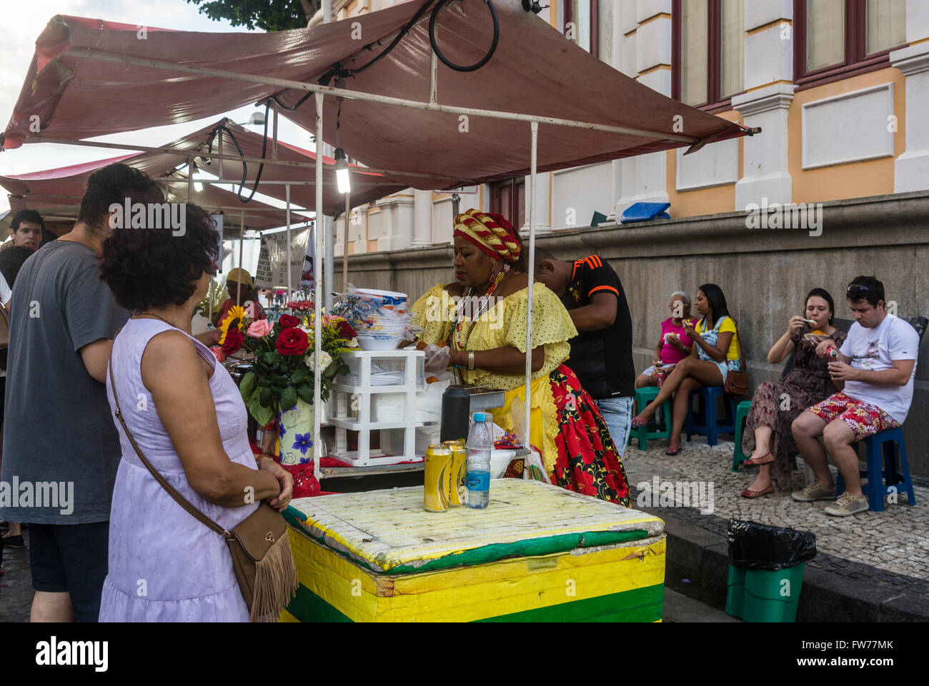 Baiana serving acarajé food from a stall in Recife Antigo, Recife ...