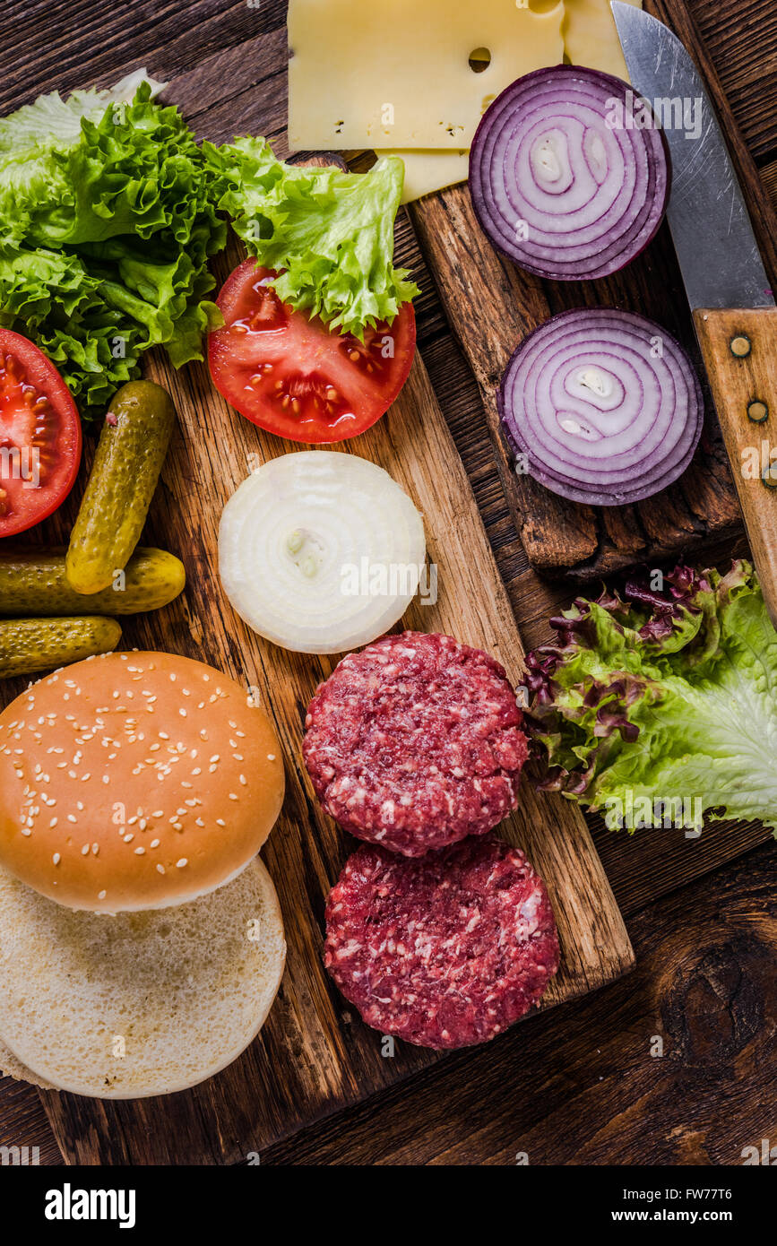 Homemade burgers ingredients on wooden rustic table Stock Photo - Alamy
