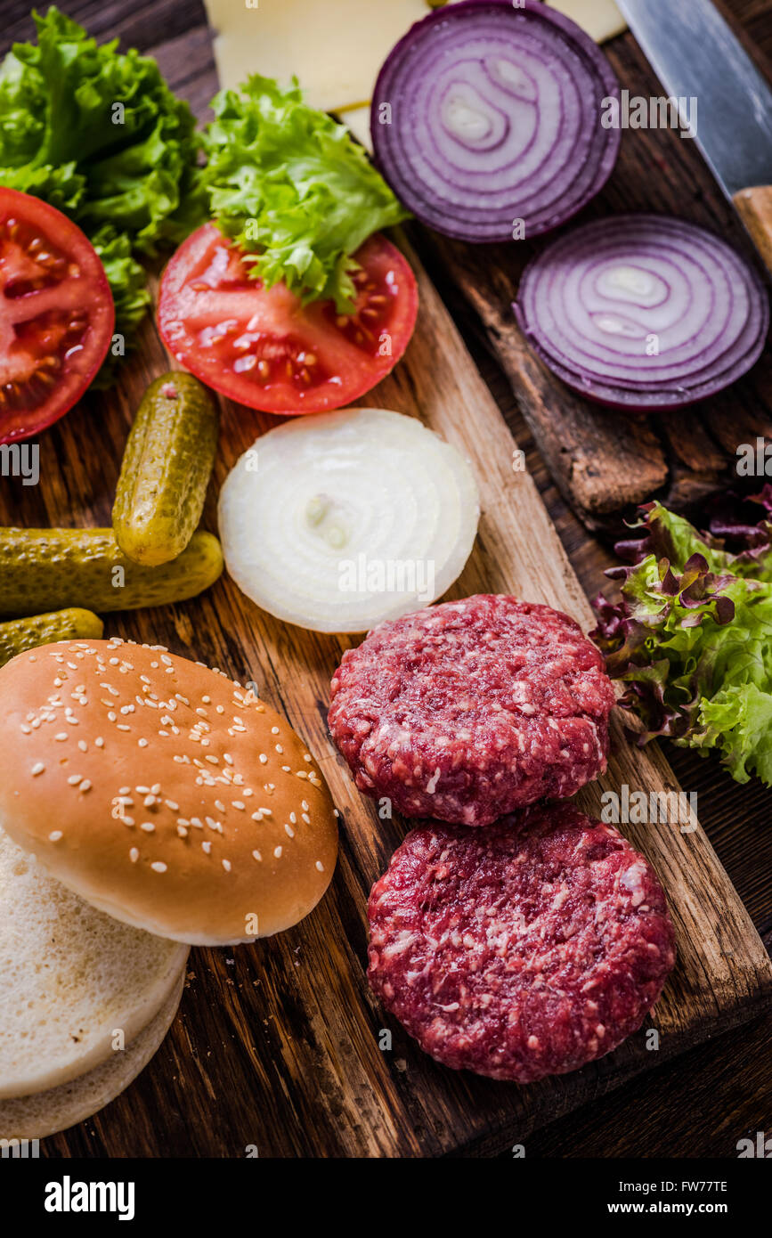 Homemade burgers ingredients on wooden rustic table Stock Photo - Alamy