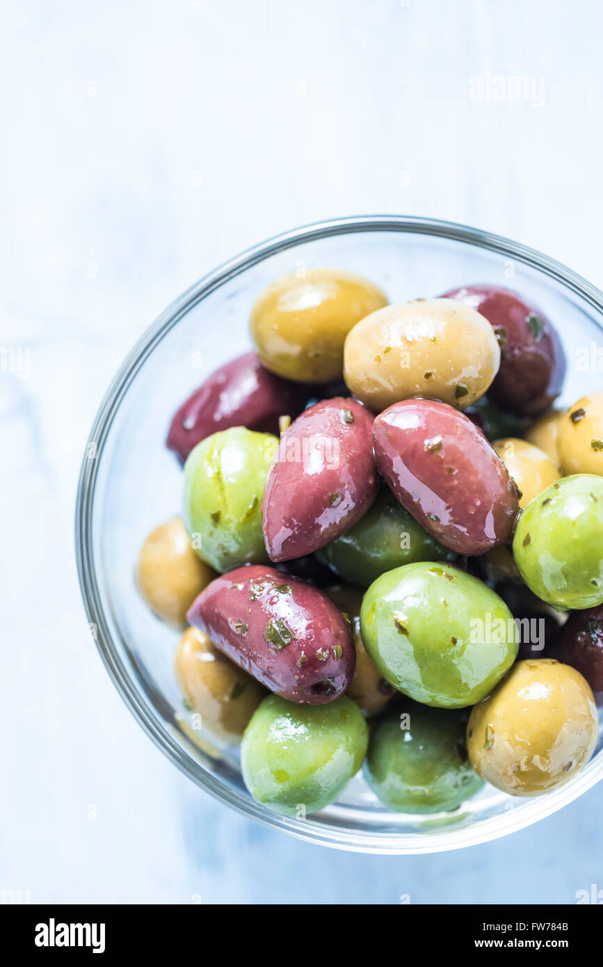 Fresh whole olives in bowl, with oil and spices.Spanish tapas concept ...