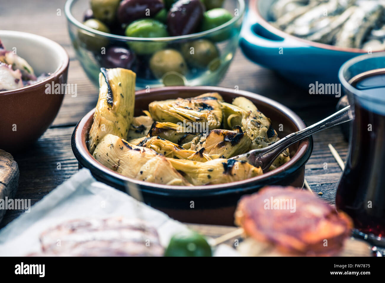 Sharing authentic spanish tapas with friends in restaurant or bar. View ...