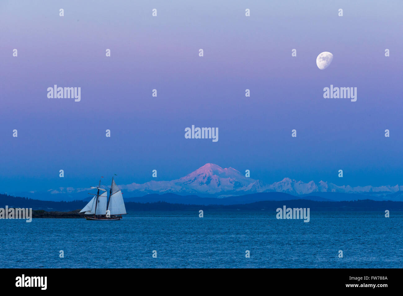Tall ship sailing vessel Pacific Swift with Mount Baker and half moon ...