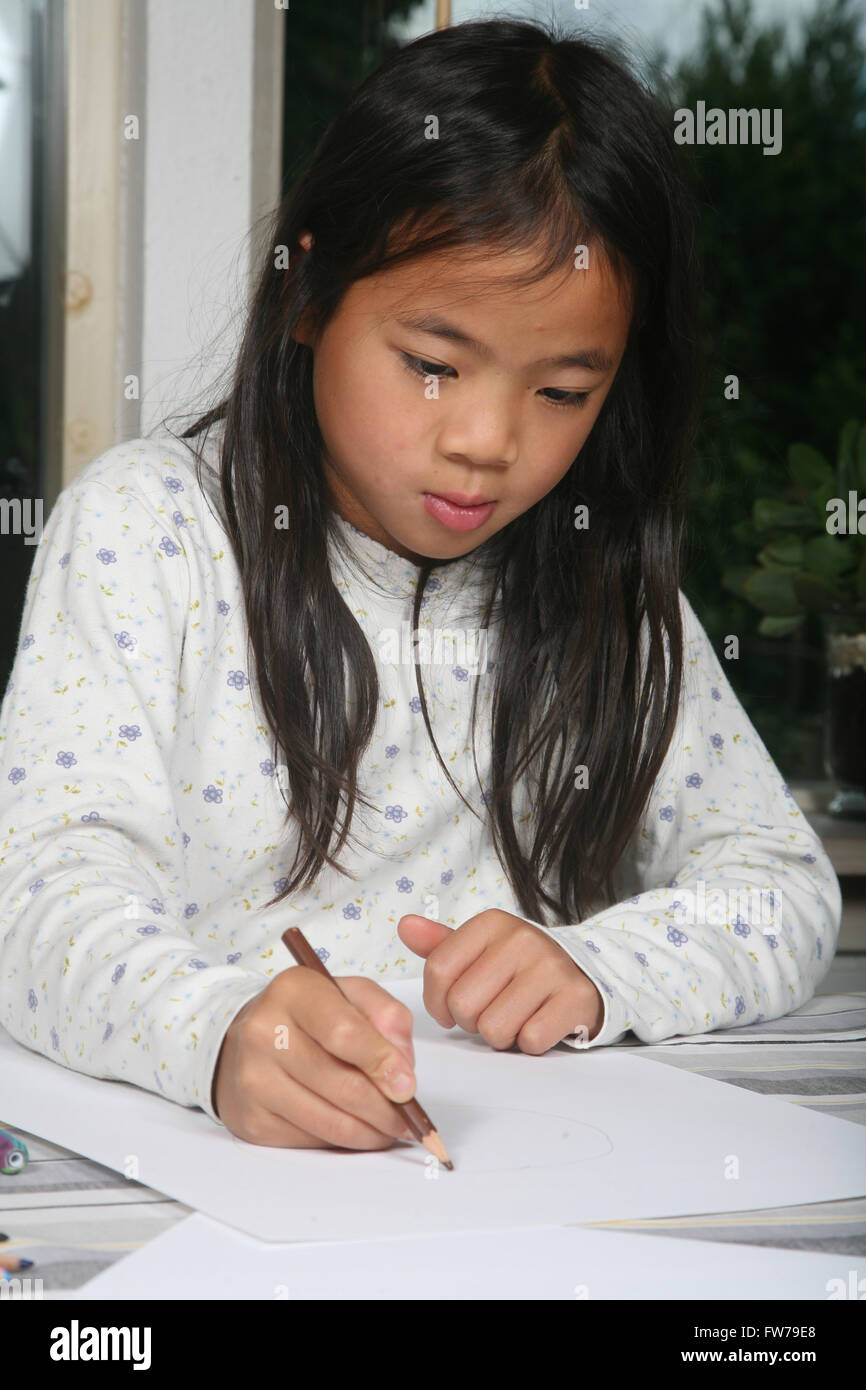 child reading a book ans studying (chinese child Stock Photo - Alamy