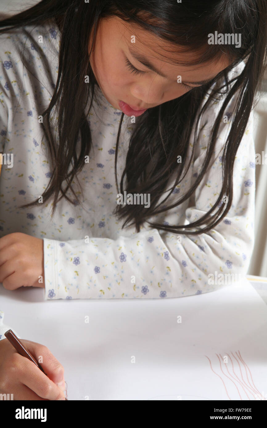 child reading a book ans studying (chinese child Stock Photo - Alamy