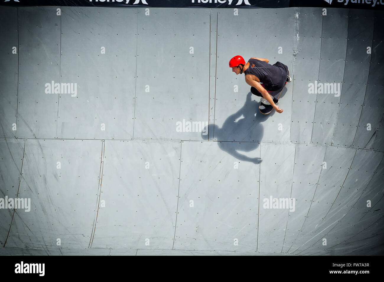 A professional skateboarder performs his tricks in a tournament in ...