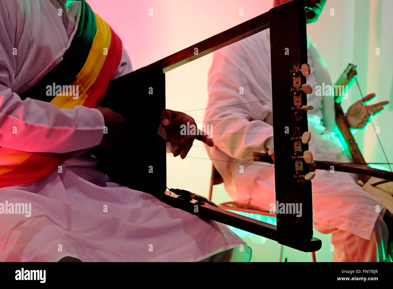 Ethiopian men playing the krar or kraar which is a five- or six ...