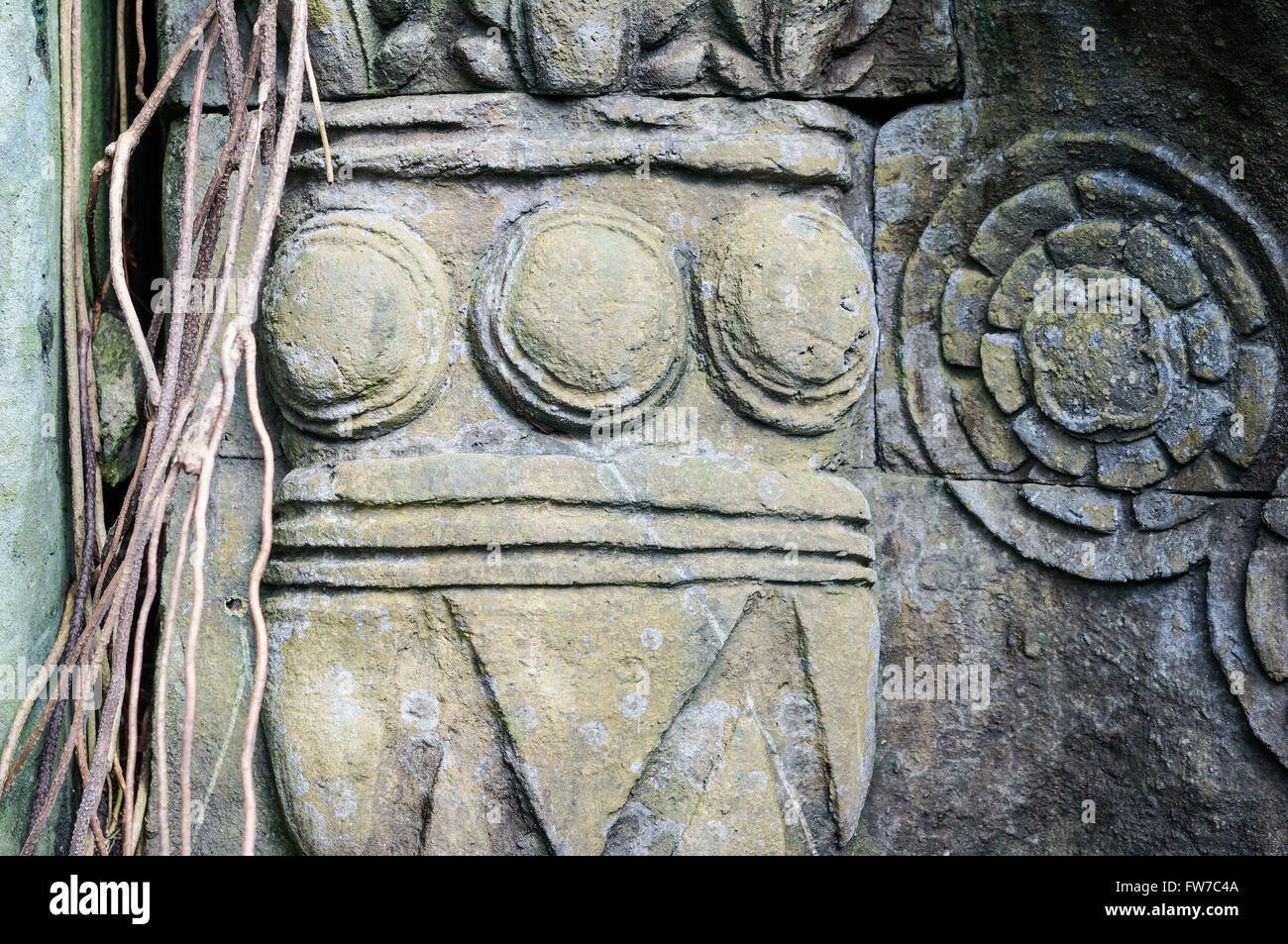 Stone tropical figure in forest, detail sections Stock Photo - Alamy