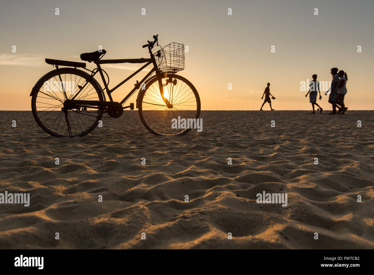 Bicycle Standing on the Beach During Sunset Stock Photo - Alamy