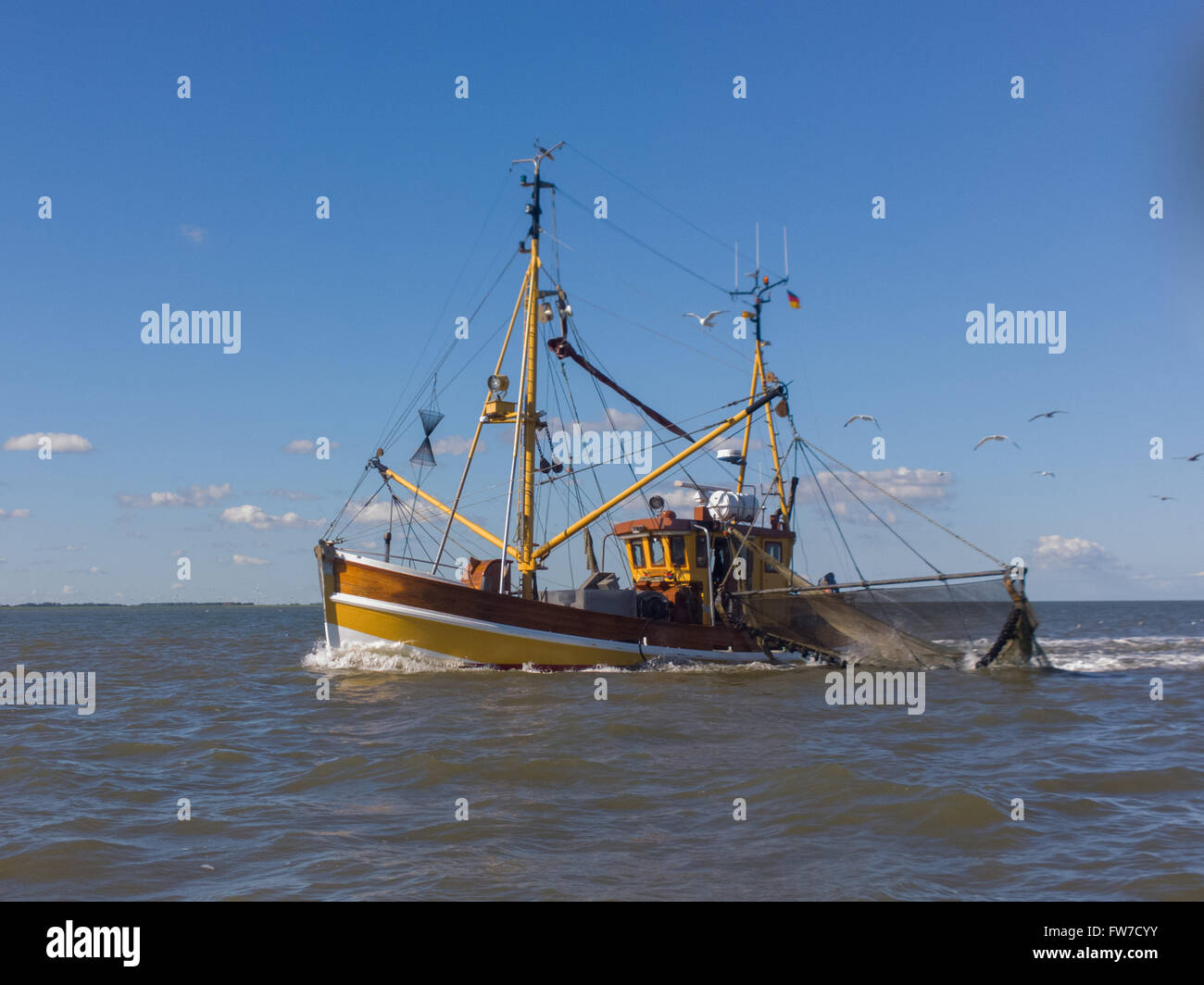 fishing boat in action - North Sea Stock Photo - Alamy