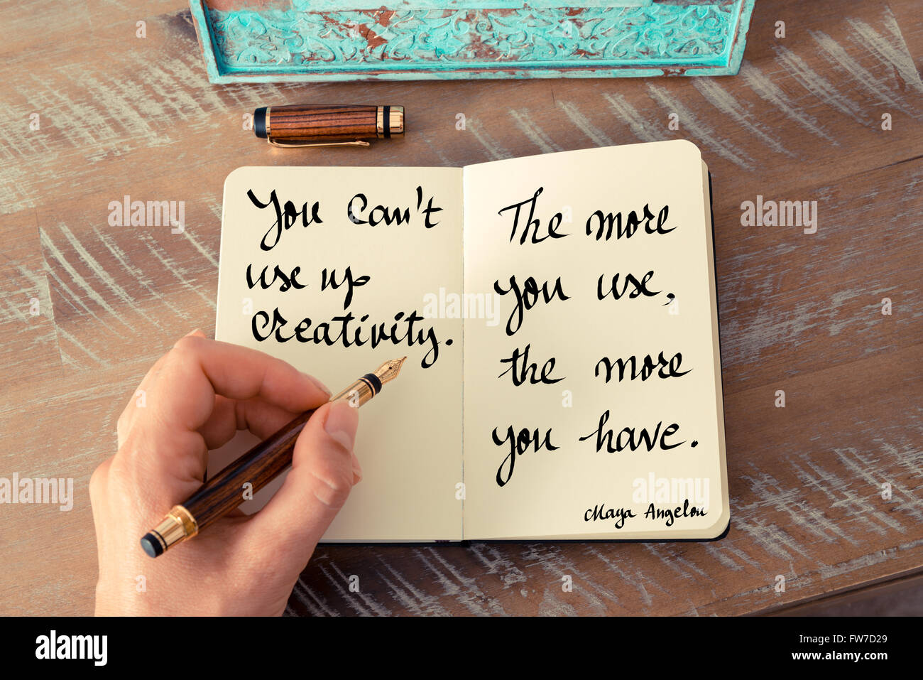 Retro effect and toned image of a woman hand writing on a notebook ...