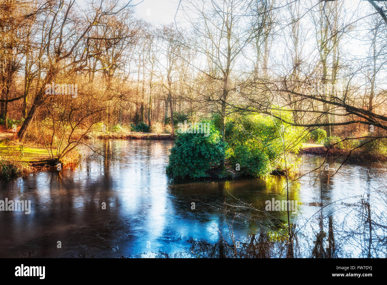 Frozen pond in the park. Landscape with partially frozen lake Stock ...
