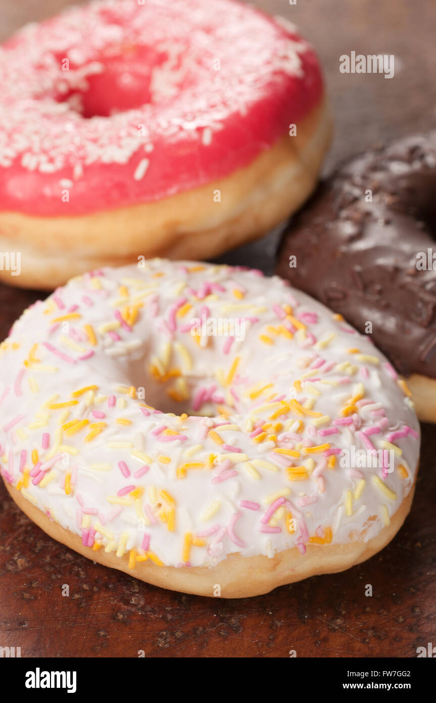 Donuts with icing and topping, close up shot Stock Photo - Alamy