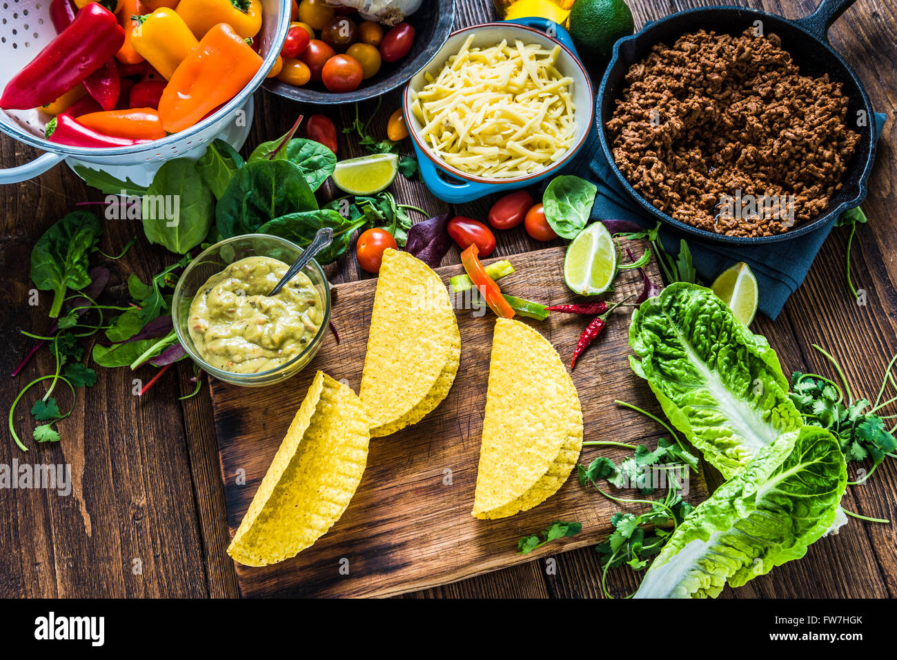 Mexican tacos with ingredients on wooden table. Overhead view ...