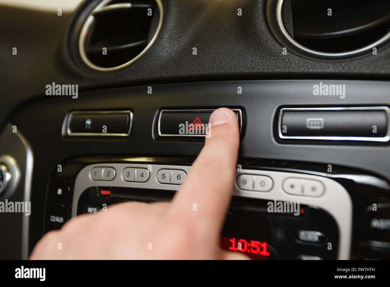 Man pressing emergency button on car dashboard (Shallow DOF Stock Photo ...