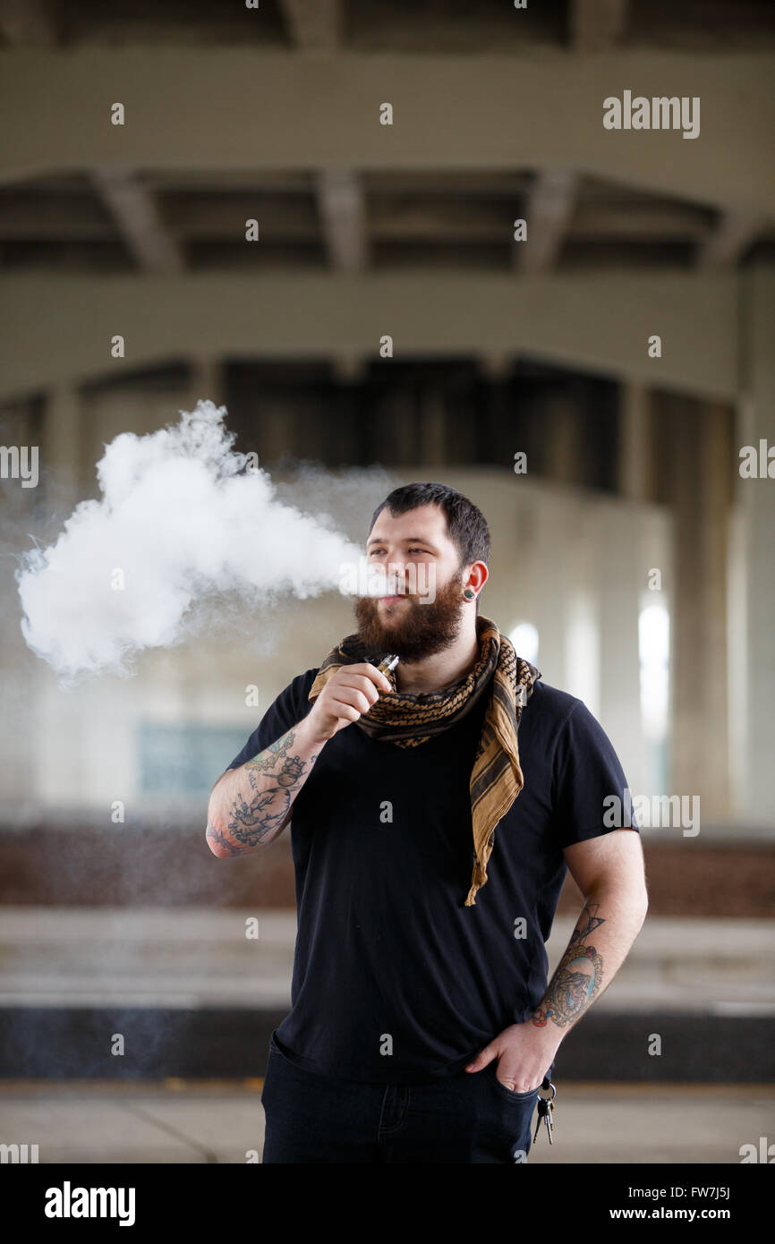 Man with tattoos smoking hi-res stock photography and images - Alamy
