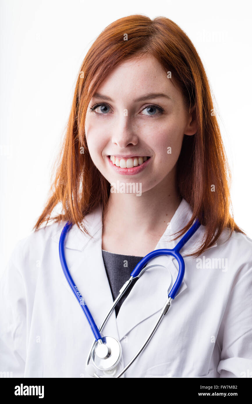 gentle doctor is a red hair big blue eyes woman smiling at you before ...