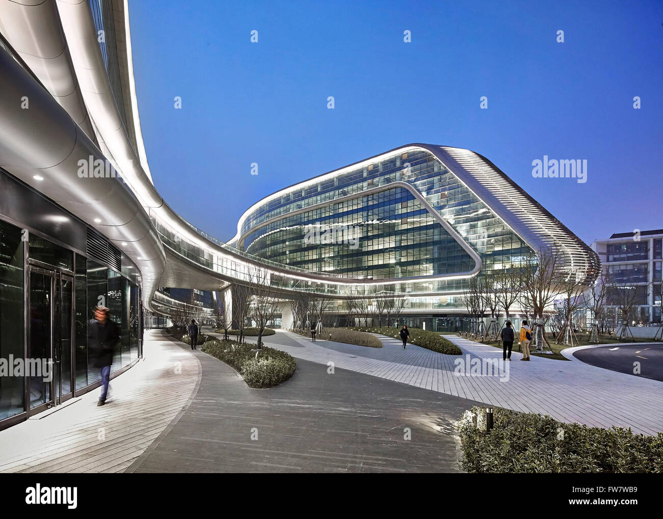 Landscaped courtyard park within building complex at night. Sky SOHO ...