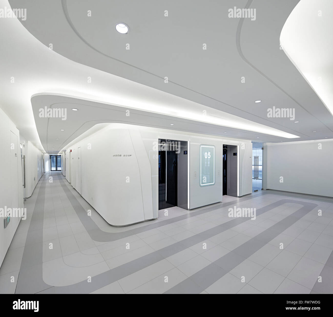 White interior and elevator waiting area. Sky SOHO, Shanghai, China ...