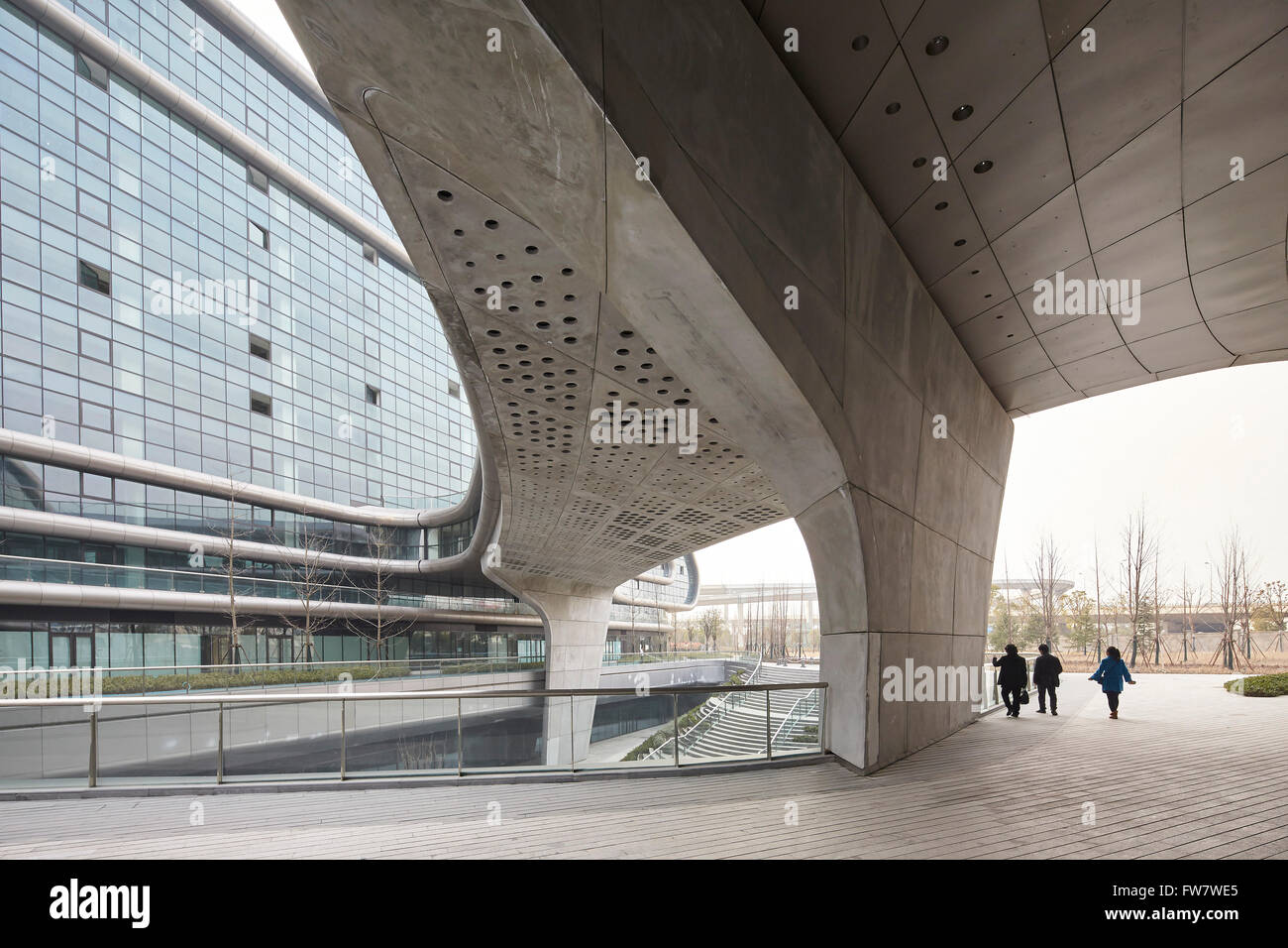 Exterior facade with landscaped walkways and bridge link. Sky SOHO ...