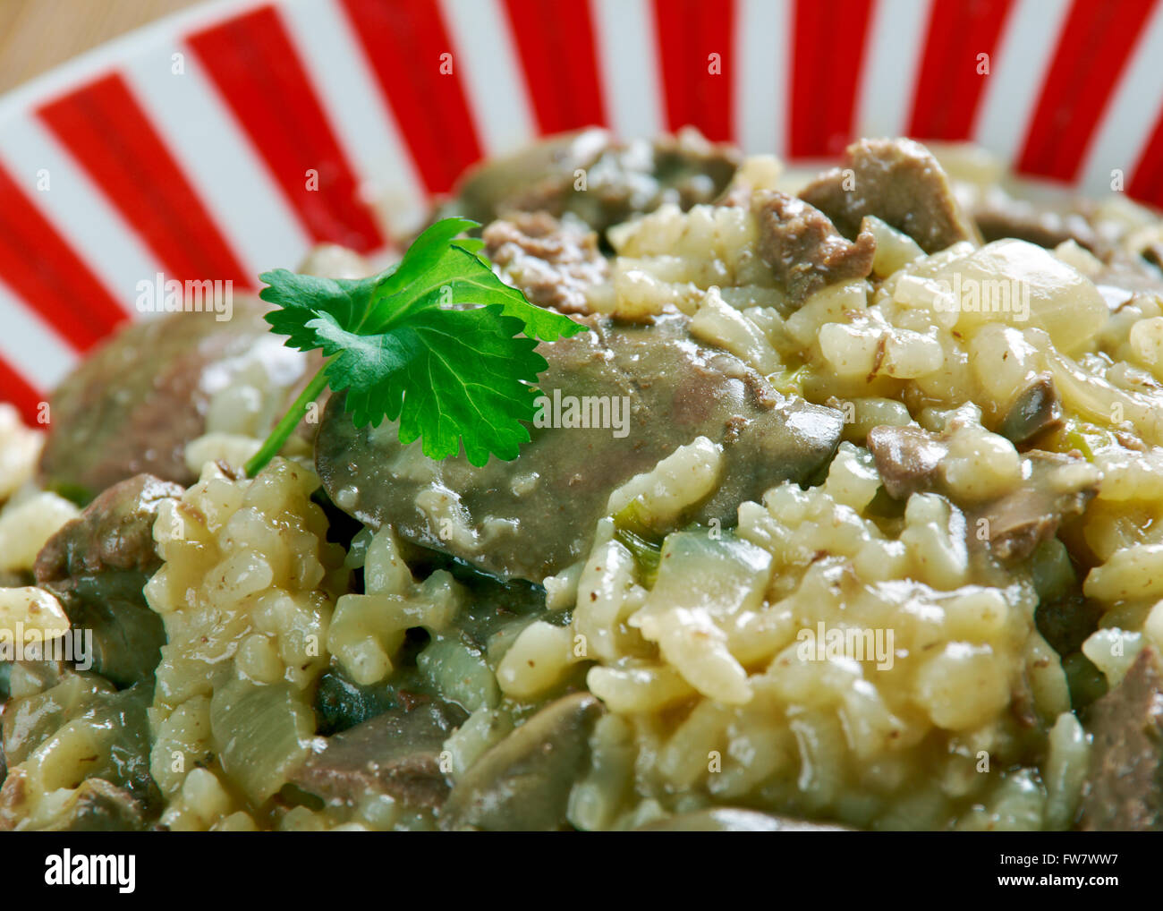 Risotto con fegatini di pollo . risotto with chicken liver Stock Photo ...