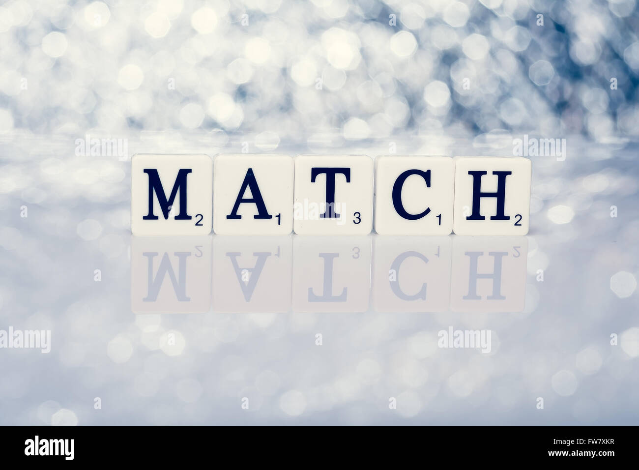 Created word of tiles with letters - match Stock Photo - Alamy