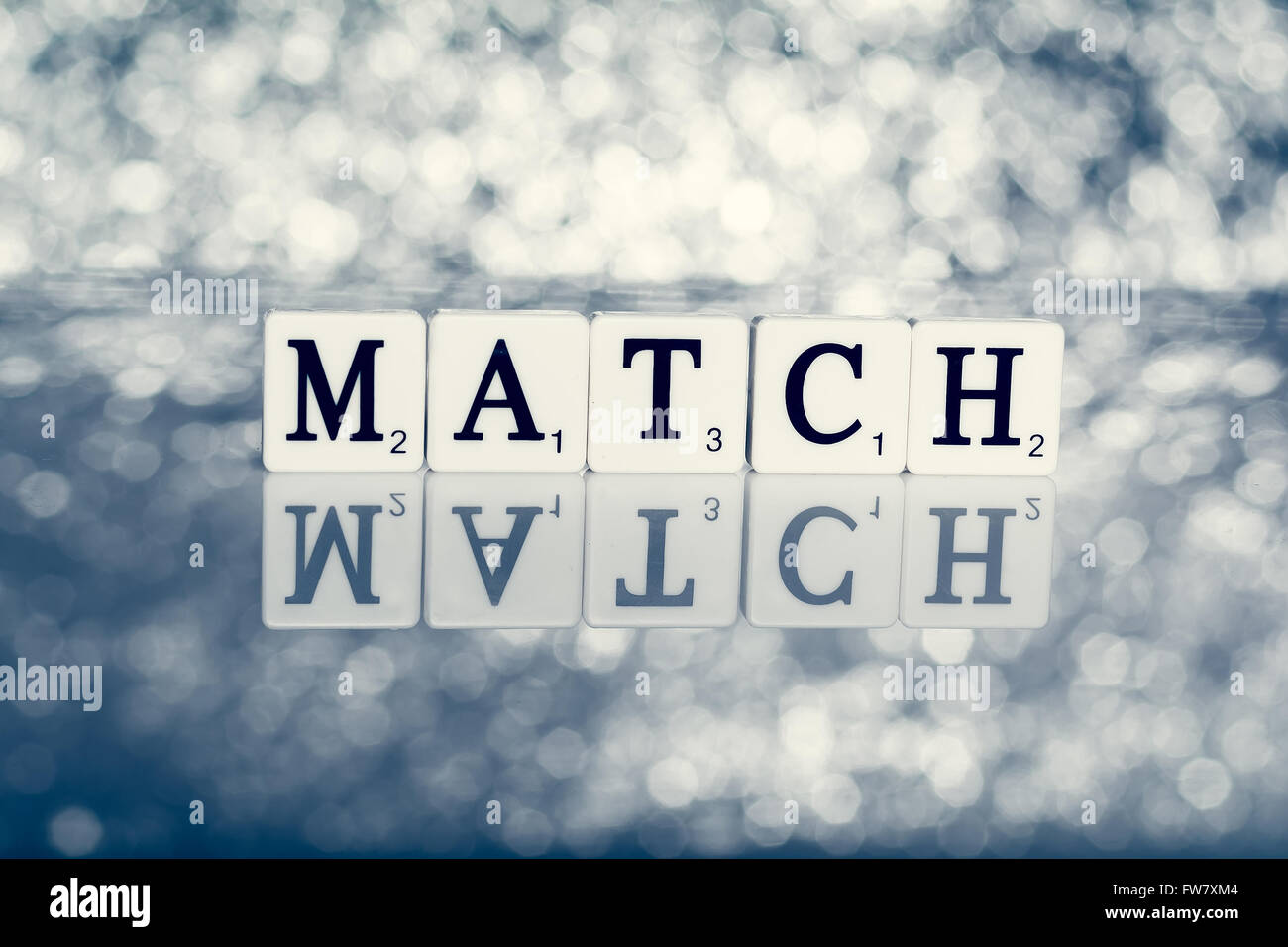 Created word of tiles with letters - match Stock Photo - Alamy