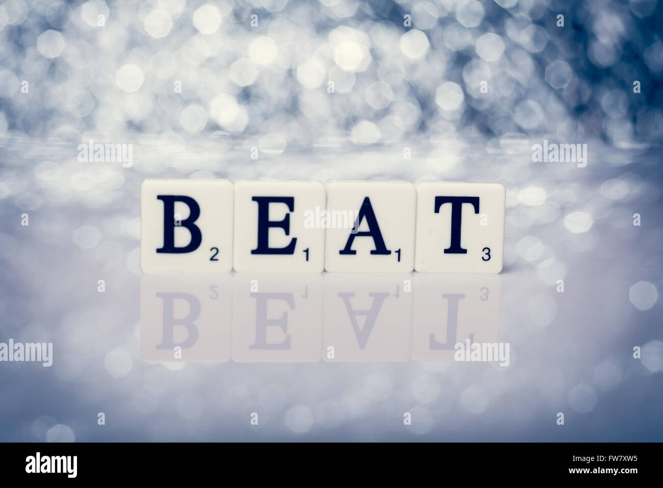 Written word of tiles with letters - beat Stock Photo - Alamy