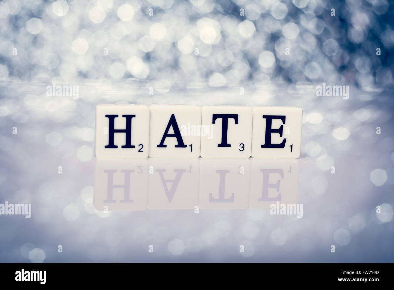 Written word of tiles with letters - hate Stock Photo - Alamy
