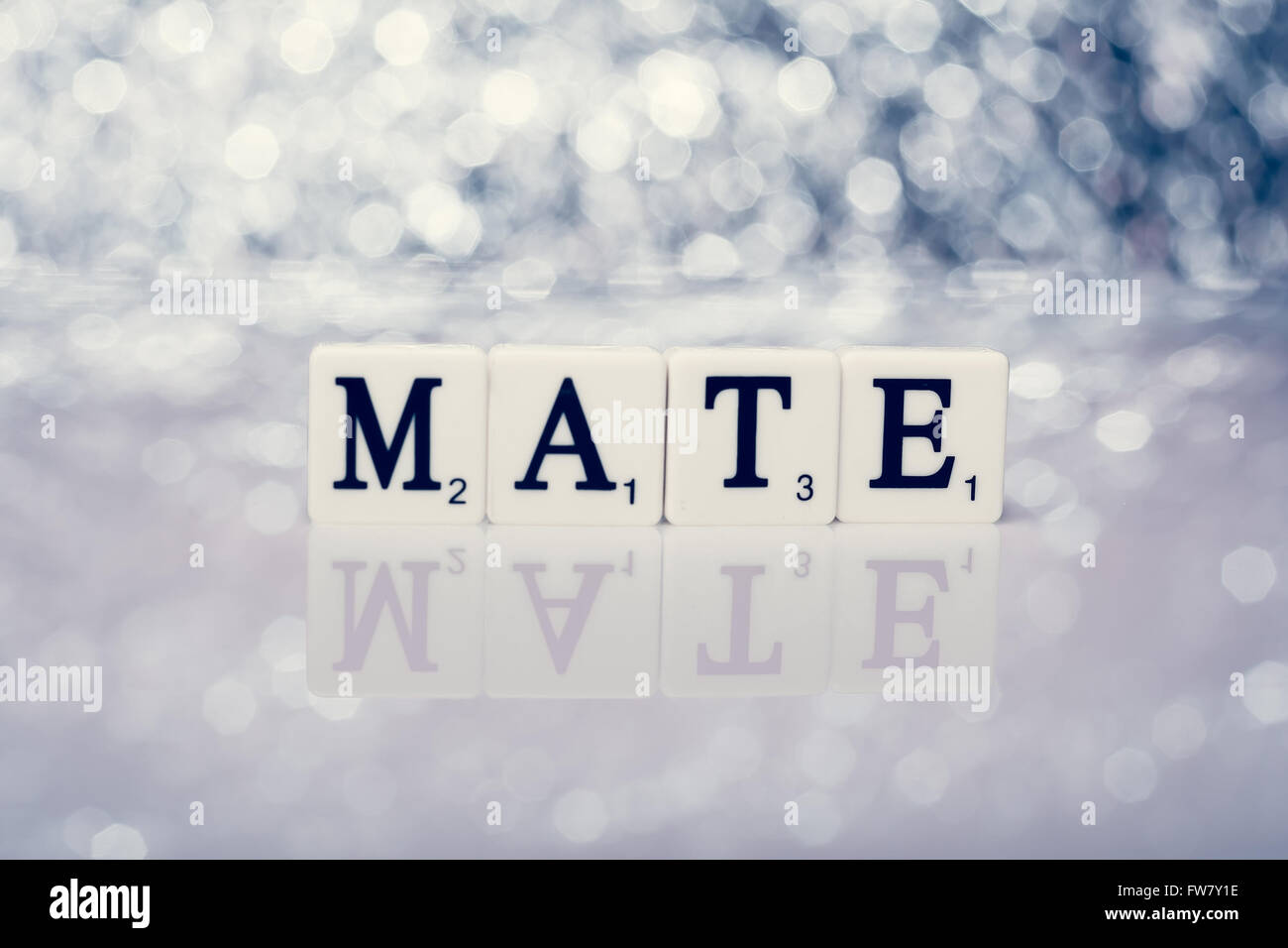 Written word of tiles with letters - mate Stock Photo - Alamy