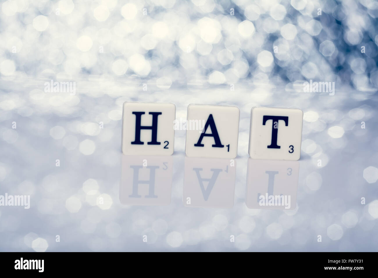Written word of tiles with letters - hat Stock Photo - Alamy