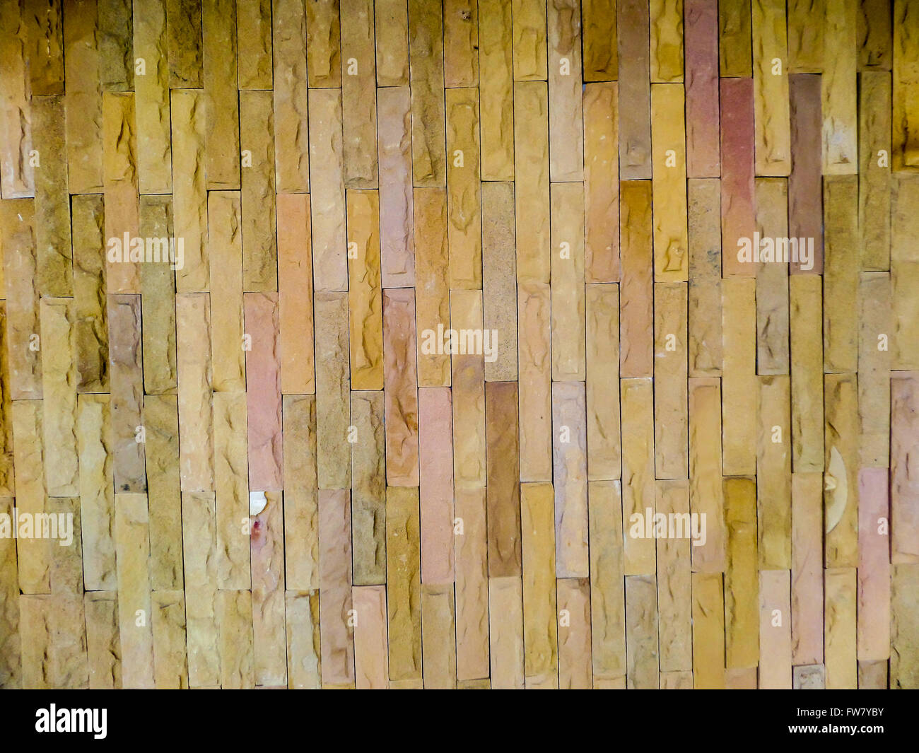 Stone tile wall and earth tone color Stock Photo - Alamy