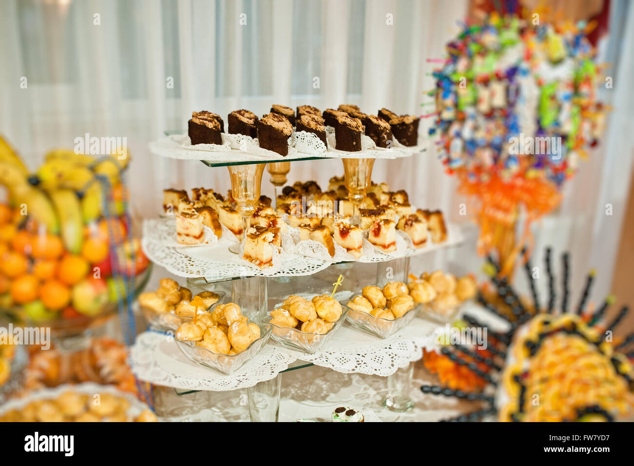 Wedding reception table of sweet candies and fruits Stock Photo - Alamy