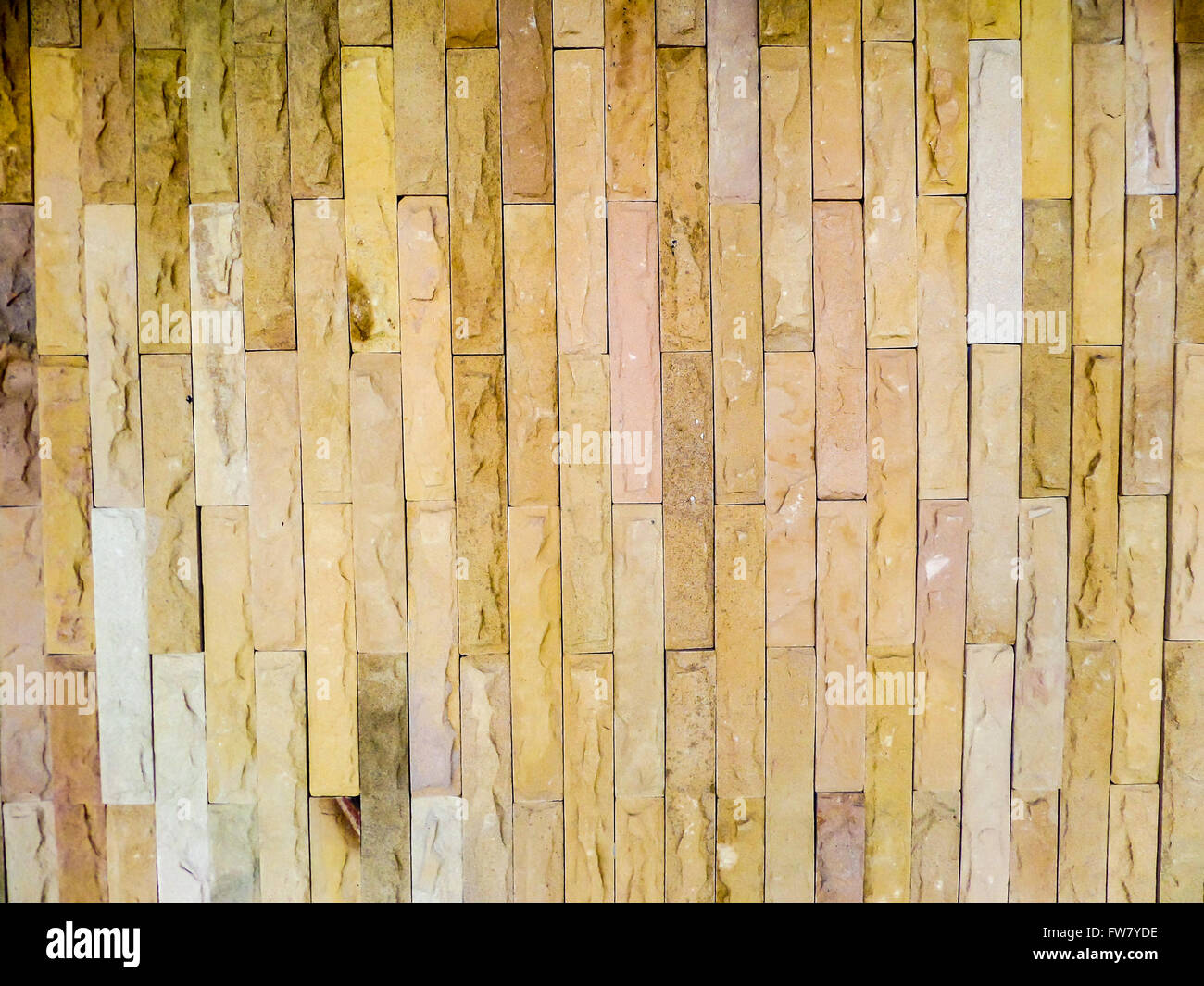 Stone tile wall and earth tone color Stock Photo - Alamy