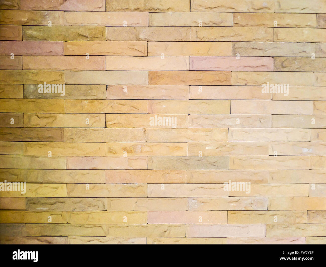 Stone tile wall and earth tone color Stock Photo - Alamy