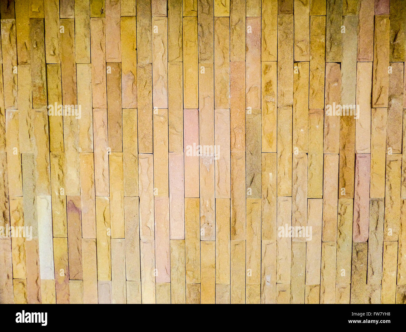 Stone tile wall and earth tone color Stock Photo - Alamy